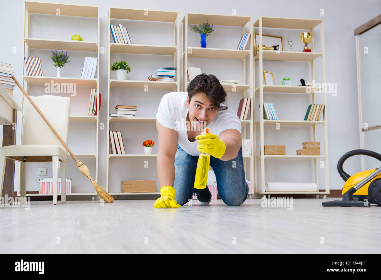 Man doing cleaning at home Stock Photo - Alamy