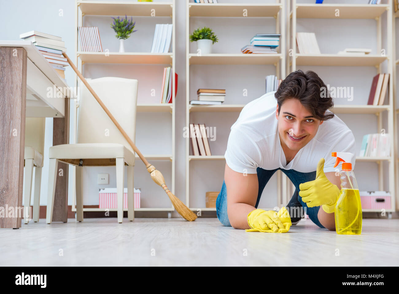 Man doing cleaning at home Stock Photo - Alamy