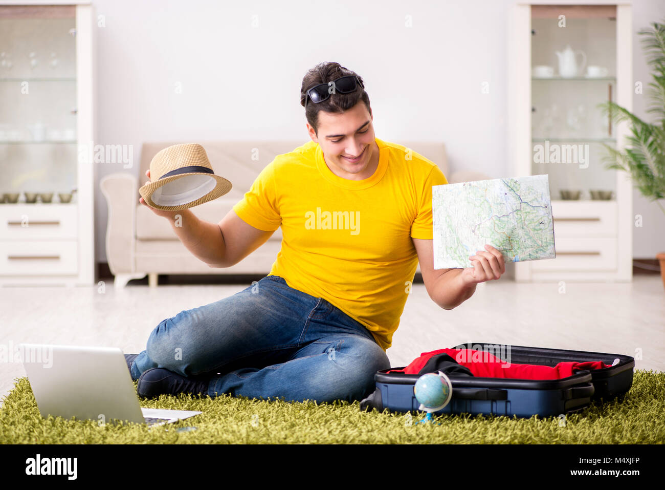 Man planning his vacation trip with map Stock Photo - Alamy
