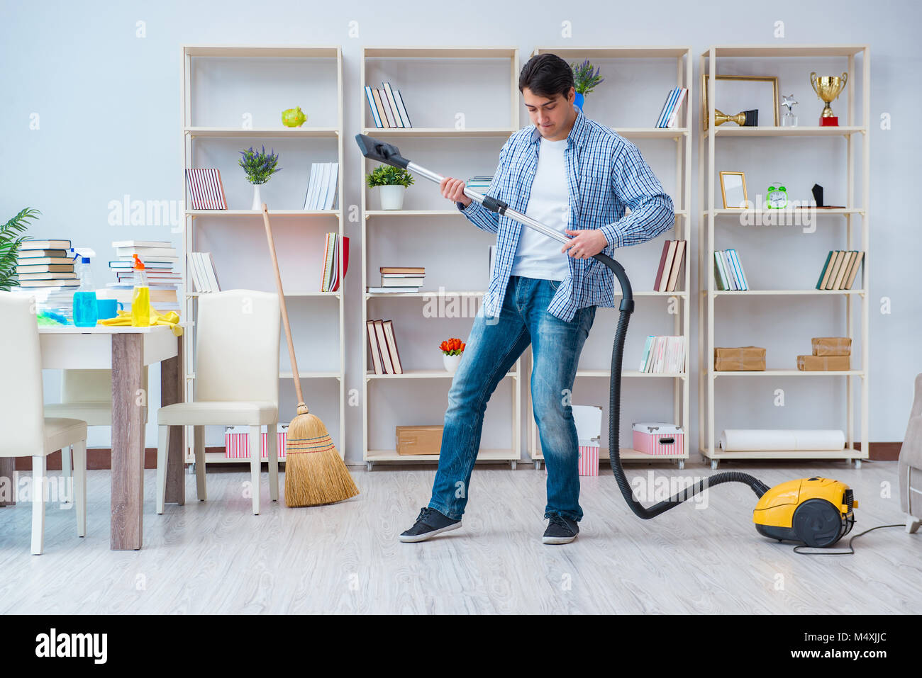 Man doing cleaning at home Stock Photo - Alamy