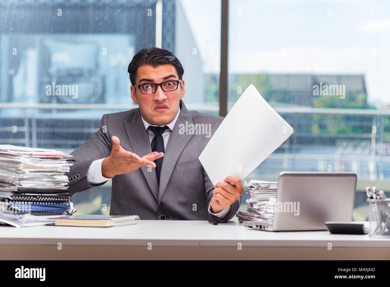 Angry businessman pointing paper hi-res stock photography and images ...