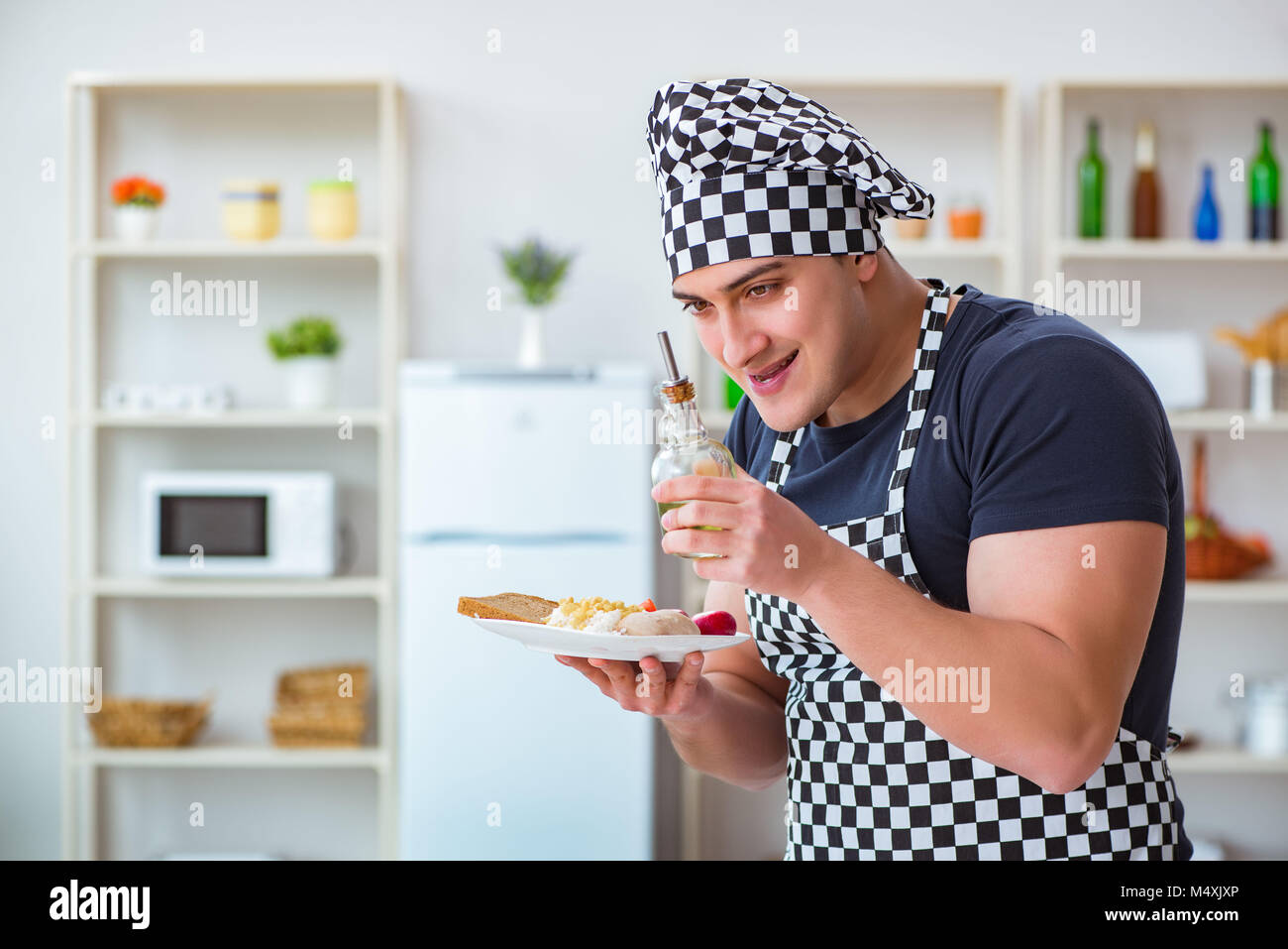Chef cook cooking a meal breakfast dinner in the kitchen Stock Photo ...
