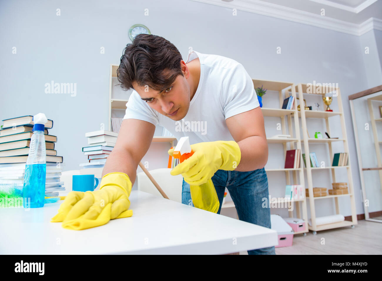 Man doing cleaning at home Stock Photo - Alamy