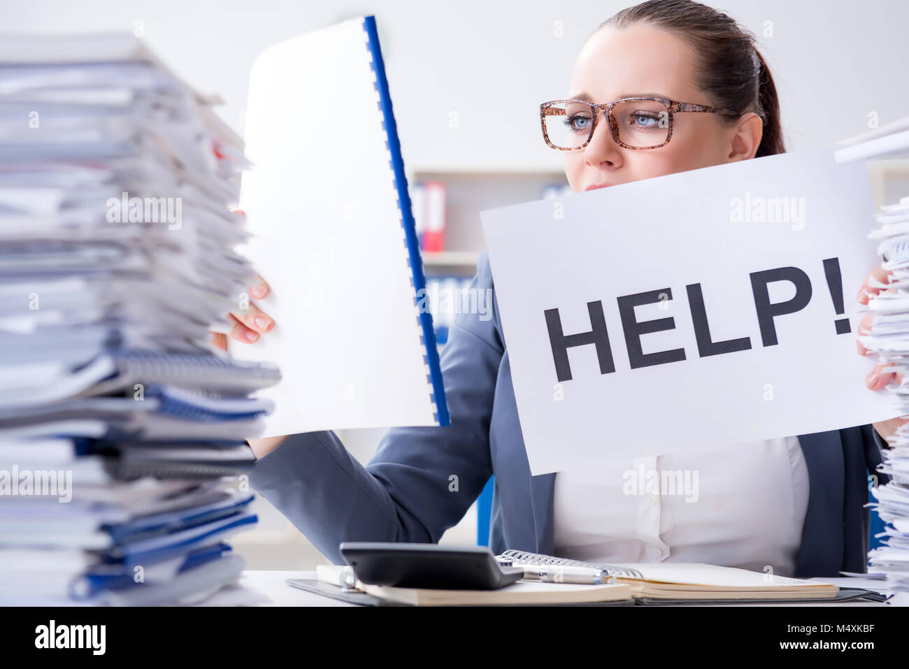 Businesswoman pleading for help in office Stock Photo - Alamy