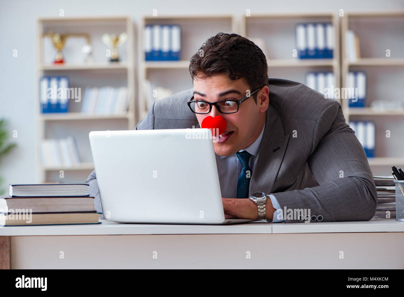 Clown businessman working in the office Stock Photo - Alamy