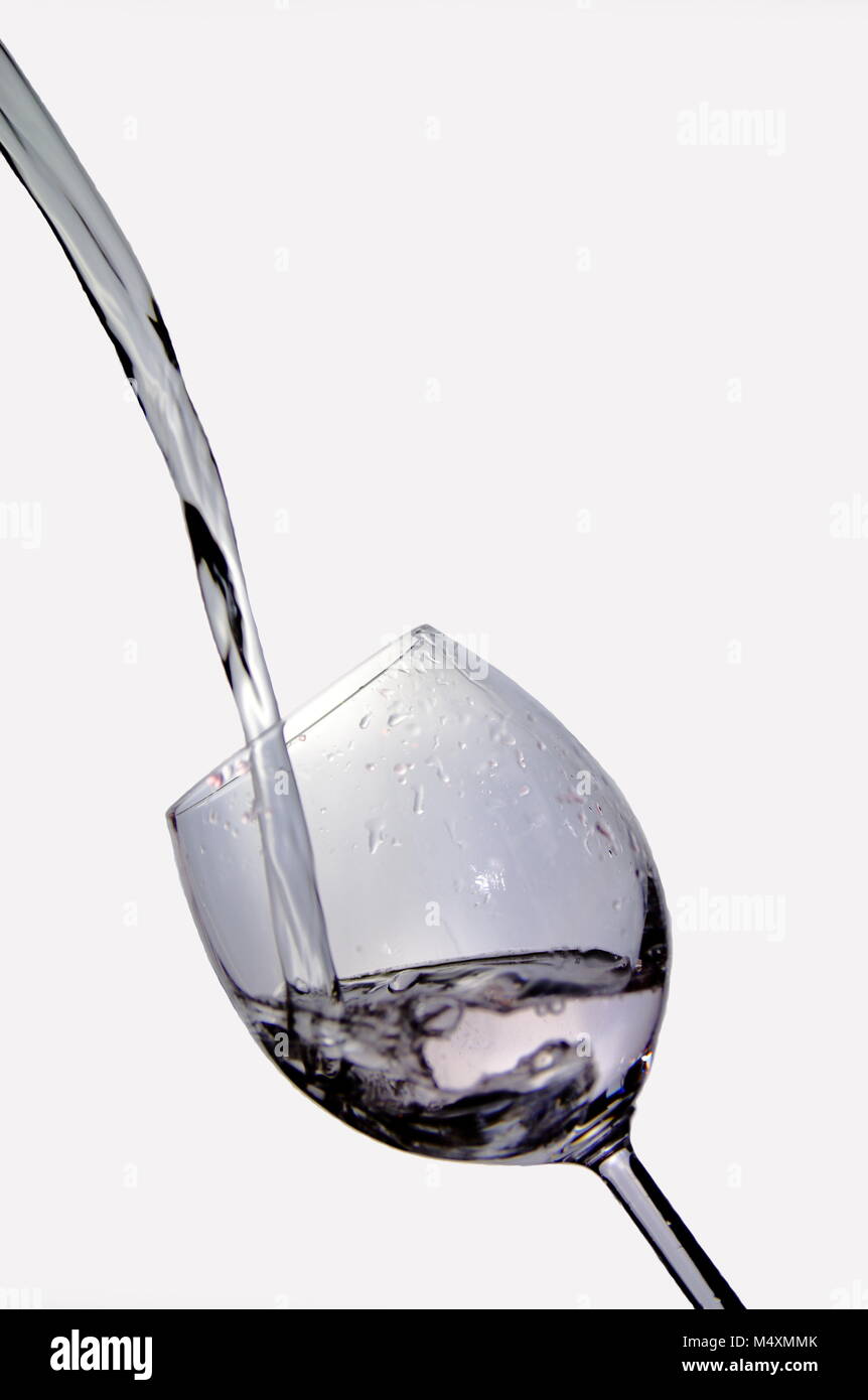 filling water into a glass Stock Photo - Alamy