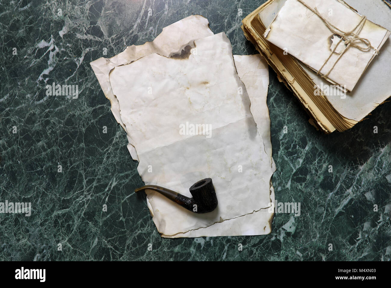 retro papers and book on detective work table with tools Stock Photo ...