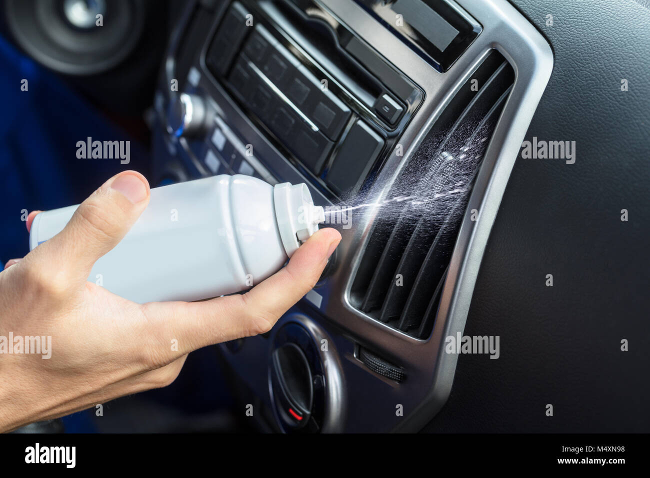 Person's Hand Cleaning Air Conditioner With Bottle In Car Stock Photo ...