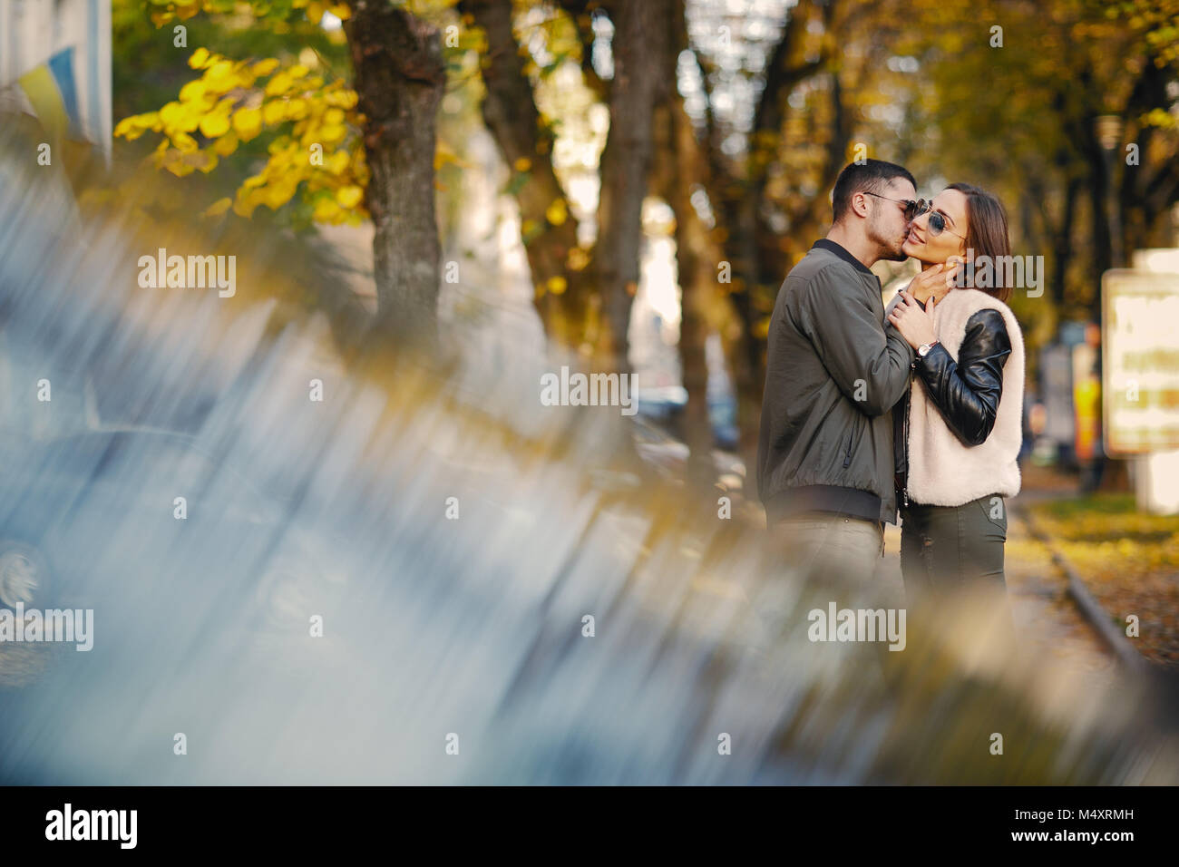 couple hanging out in the city Stock Photo - Alamy