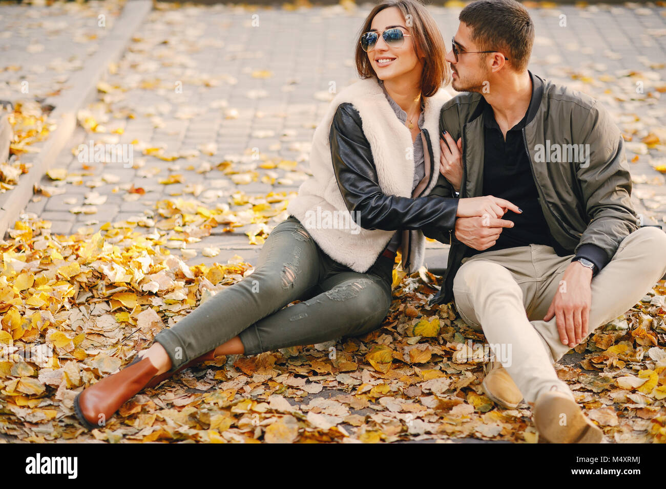 couple hanging out in the city Stock Photo - Alamy
