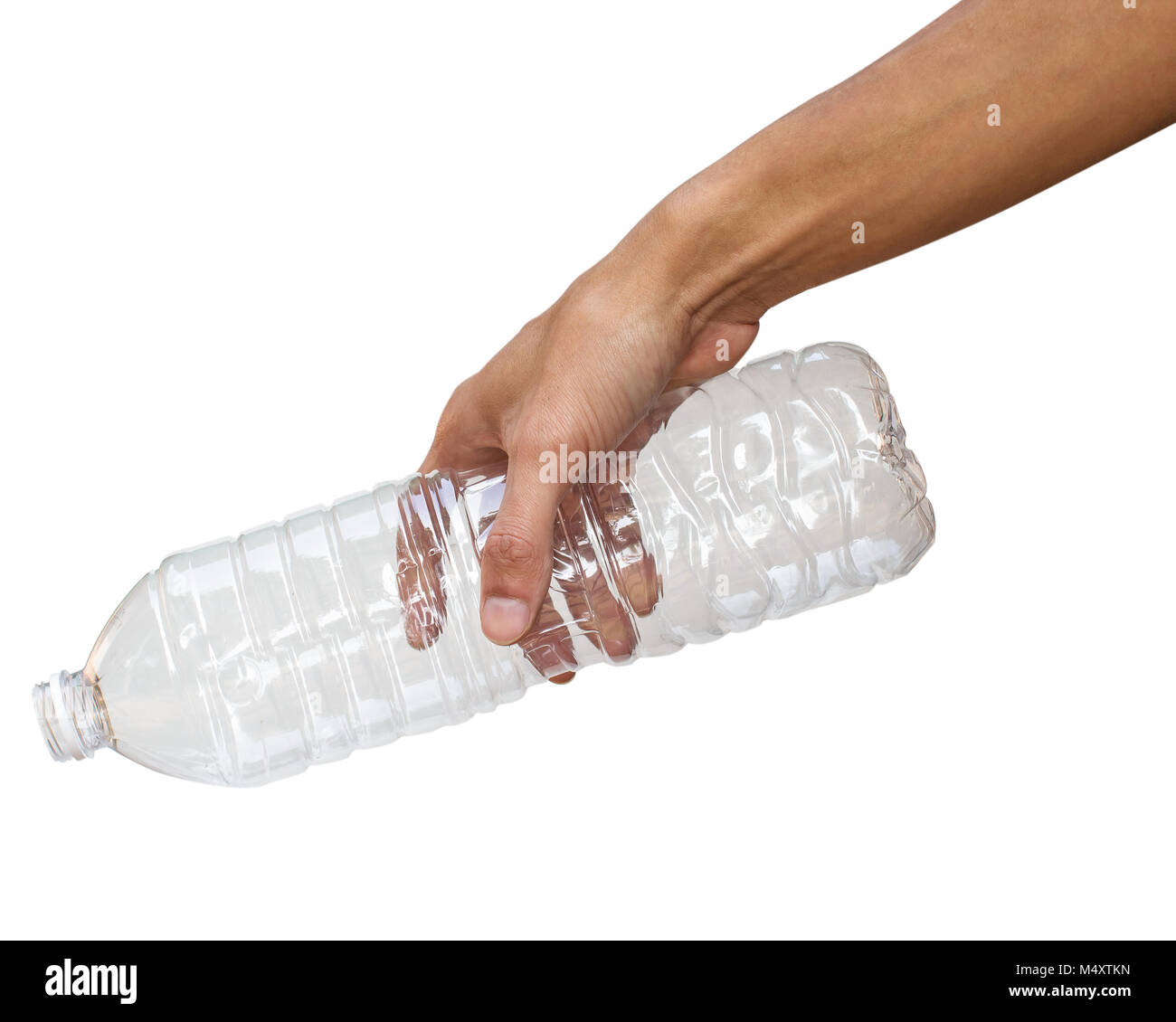 Hand holding clear bottle like a pouring water isolated on white background with clipping path ...
