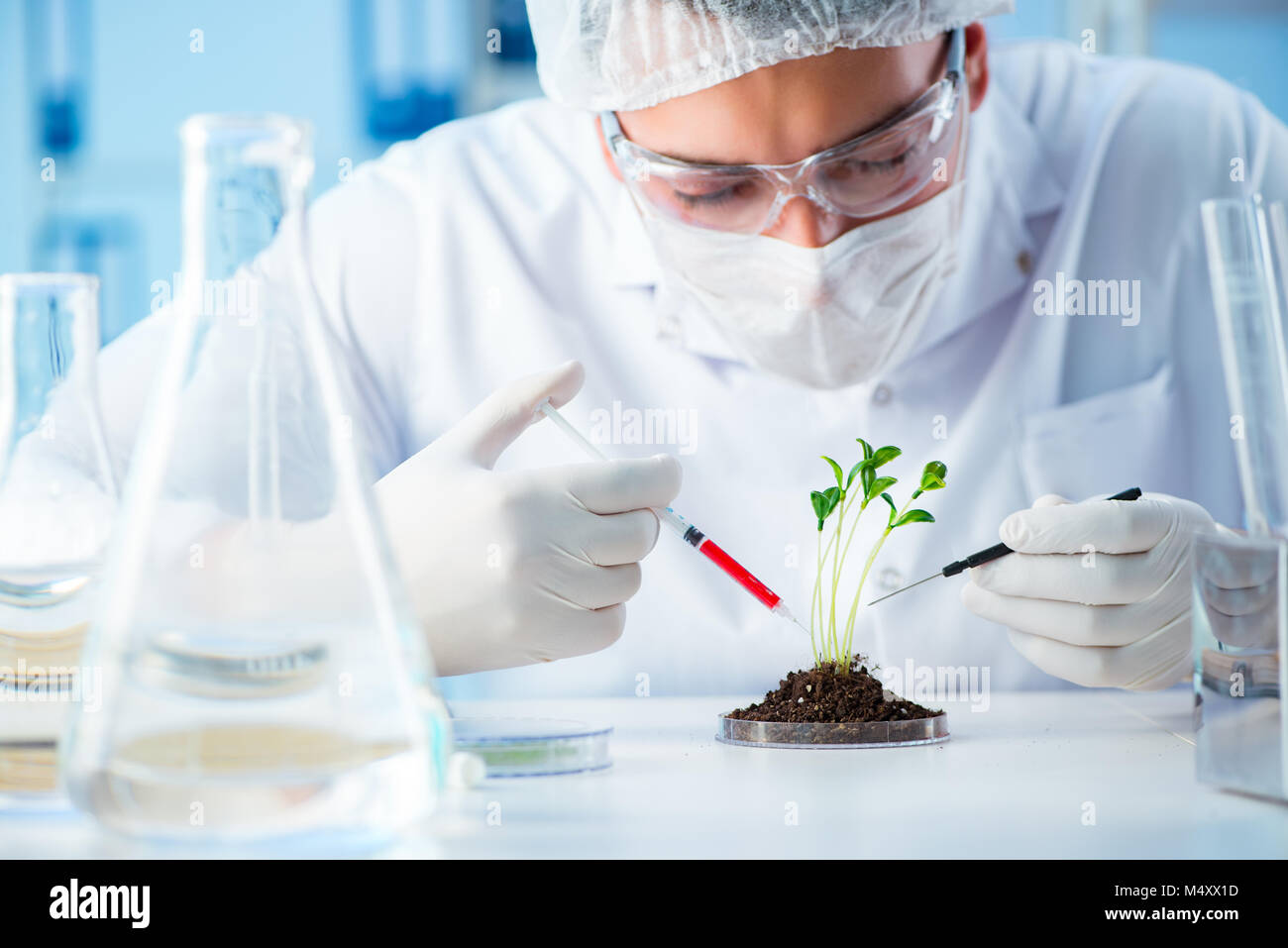 Biotechnology concept with scientist in lab Stock Photo - Alamy