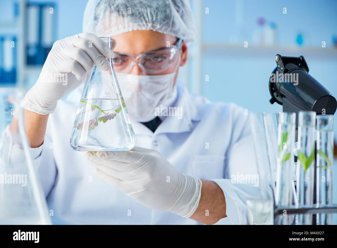 Biotechnology concept with scientist in lab Stock Photo - Alamy