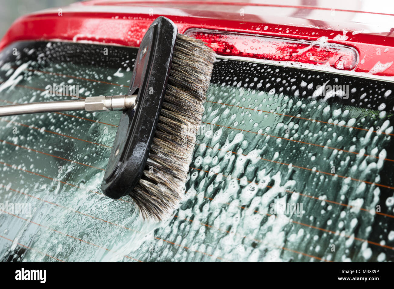 Close-up Of Person's Hand Washing Car Using Broom Stock Photo - Alamy