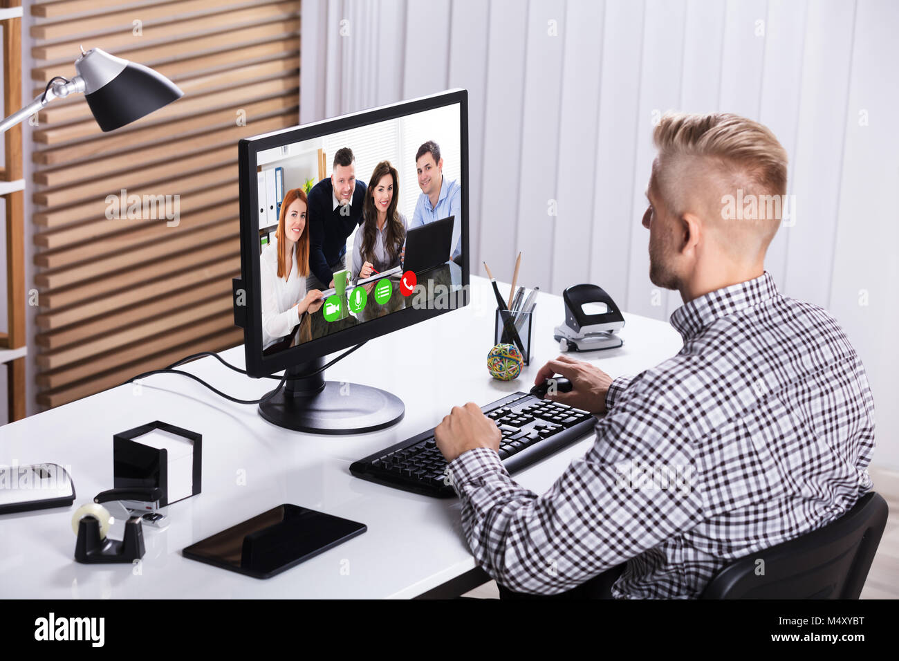 Businessman Video Conference With His Colleagues On Computer On Desk In ...