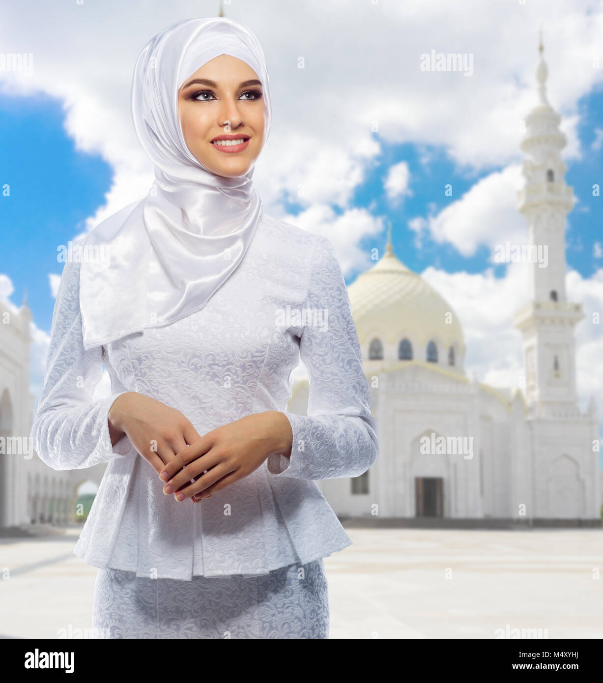 Young muslim girl on white mosque background Stock Photo - Alamy