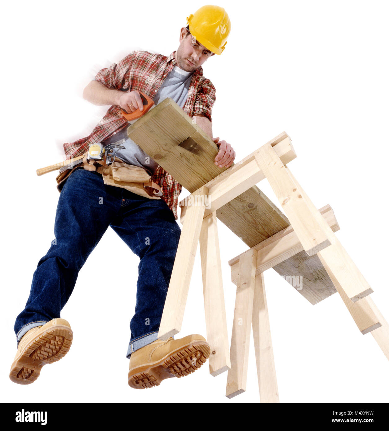 A carpenter drilling wood on a workbench Stock Photo - Alamy