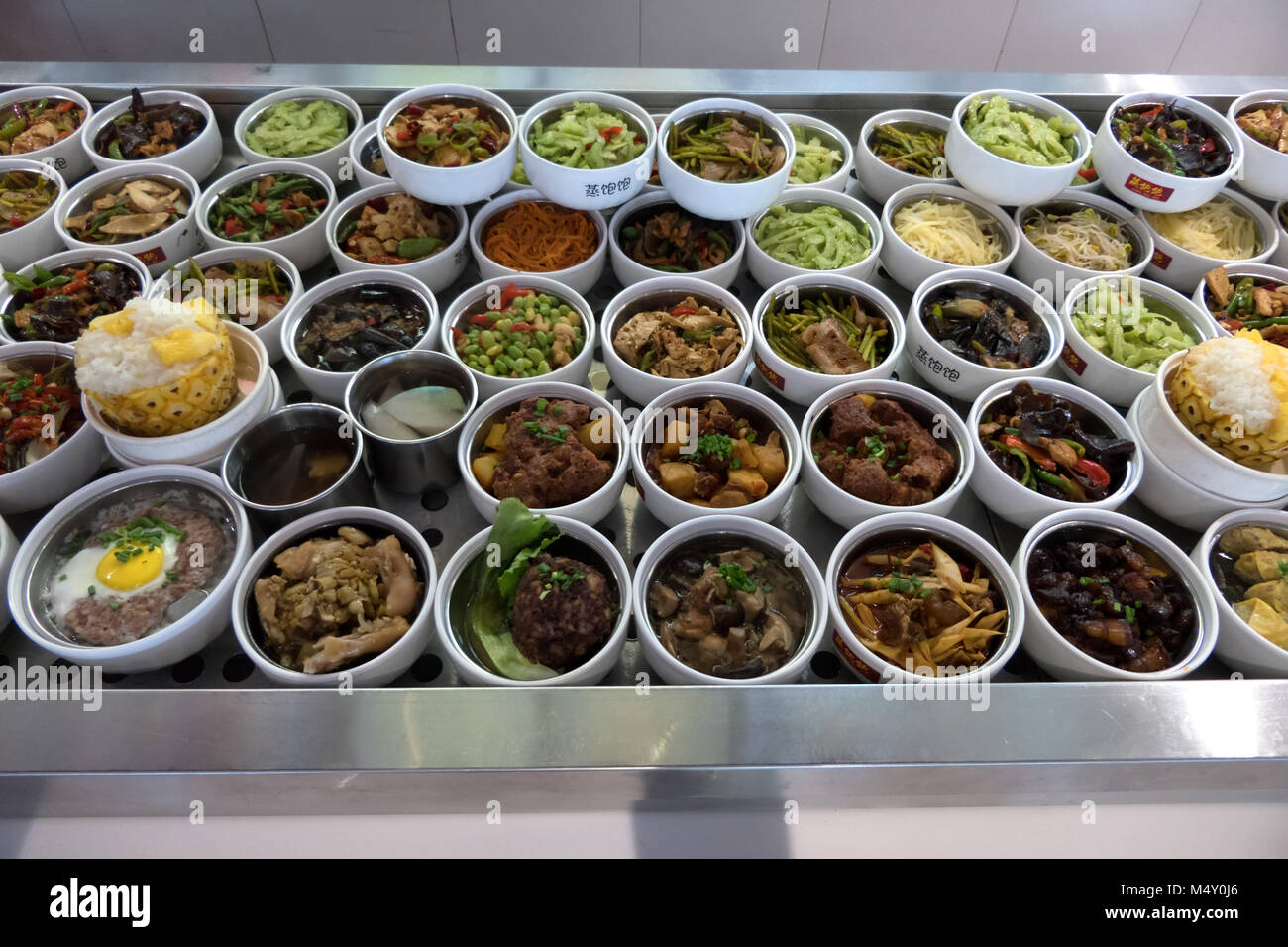 Bowls of traditional Chinese food in restaurant kitchen. Chengdu ...