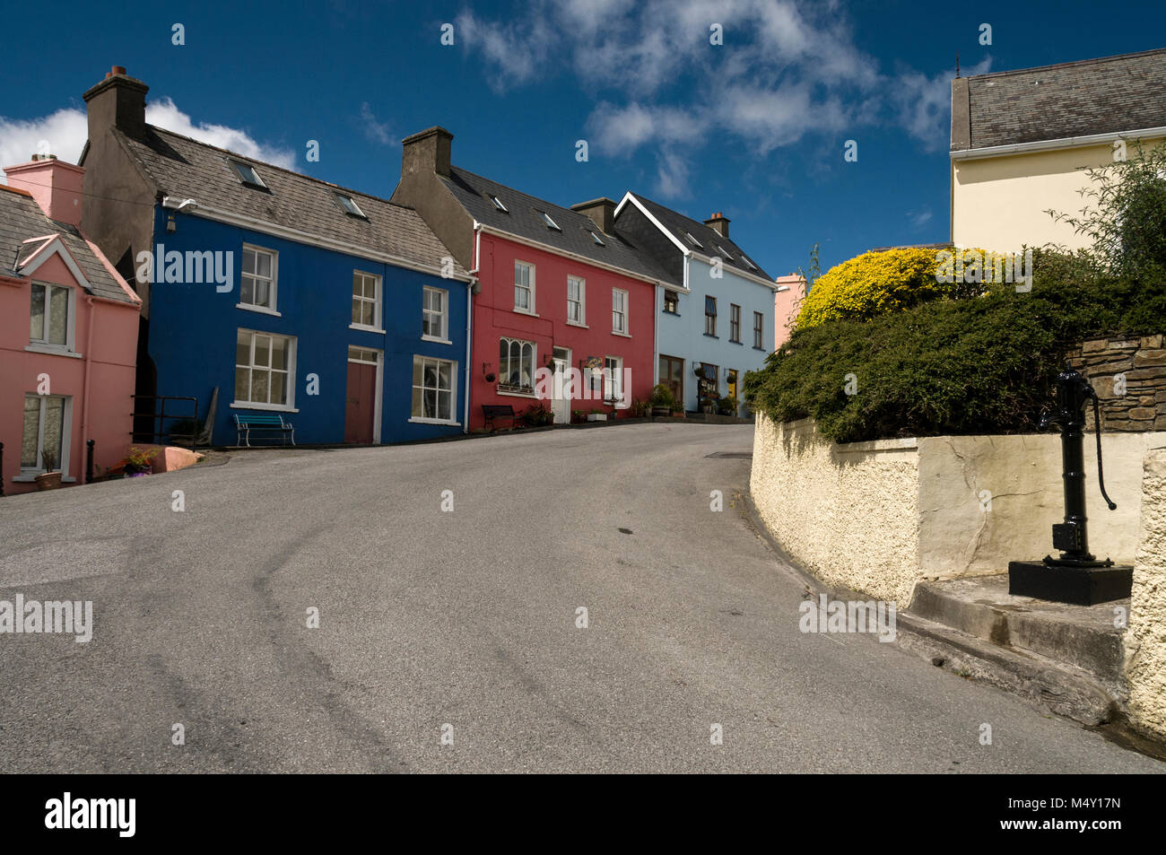 Bright pastel paintwork of its terraced houses in Eyeries village on ...