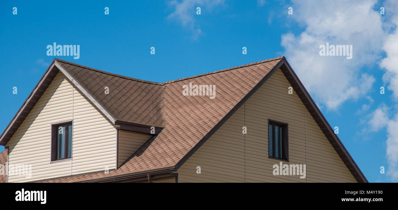 house with a gable roof window Stock Photo - Alamy
