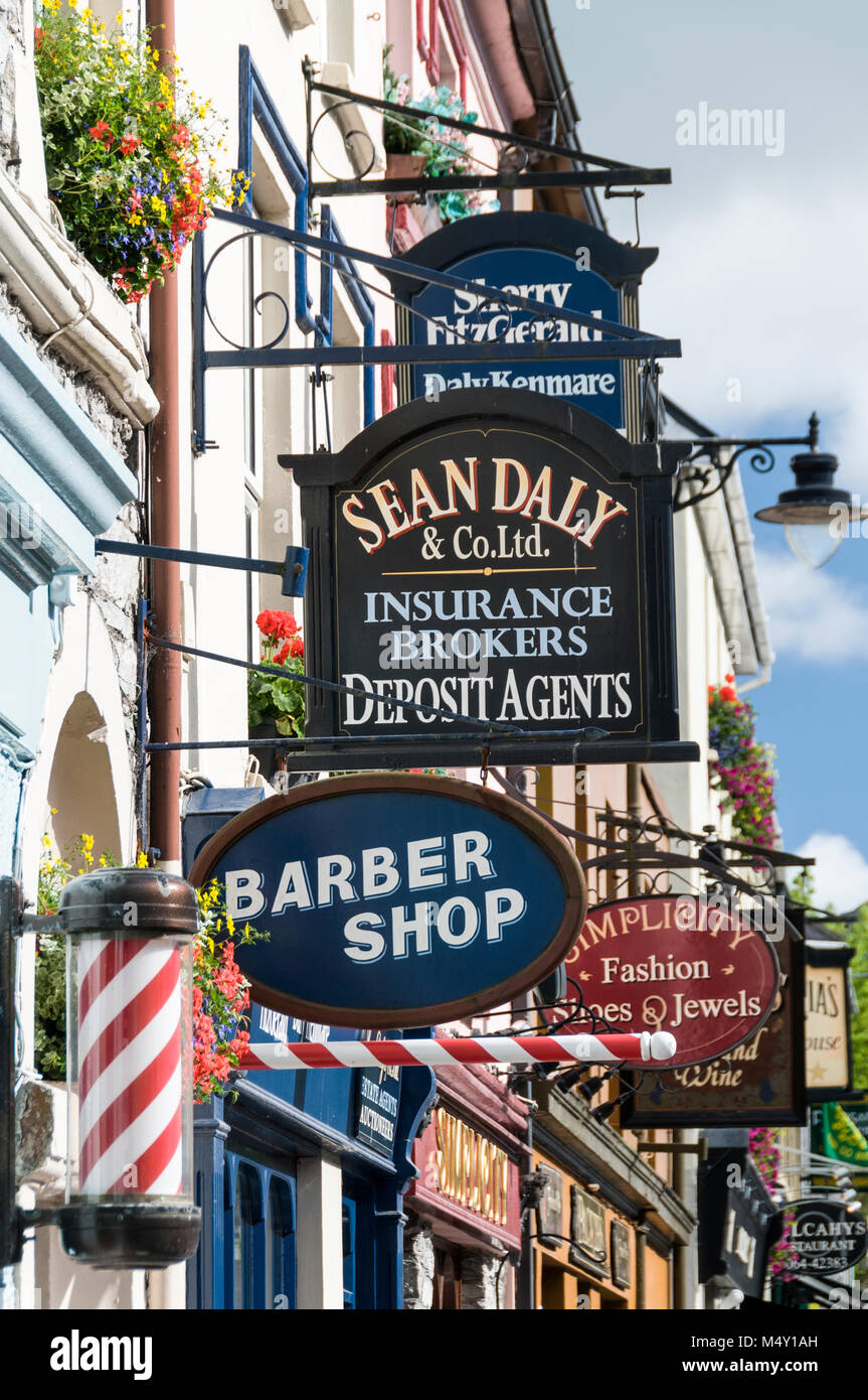 A mass of signs outside shops and eateries in busy Henry Street in ...