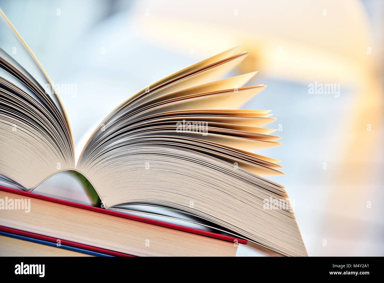 Books lying on the table in the public library Stock Photo - Alamy