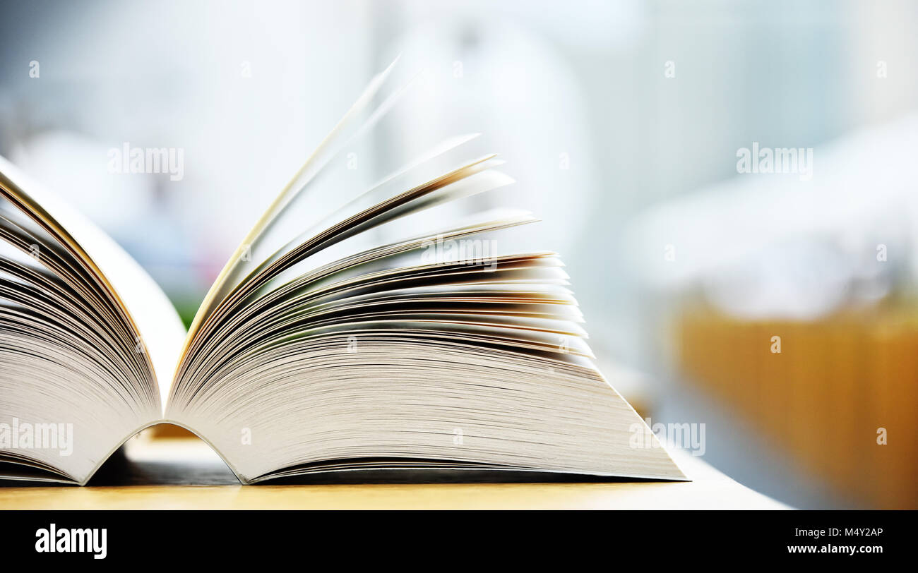 Books lying on the table in the public library Stock Photo - Alamy