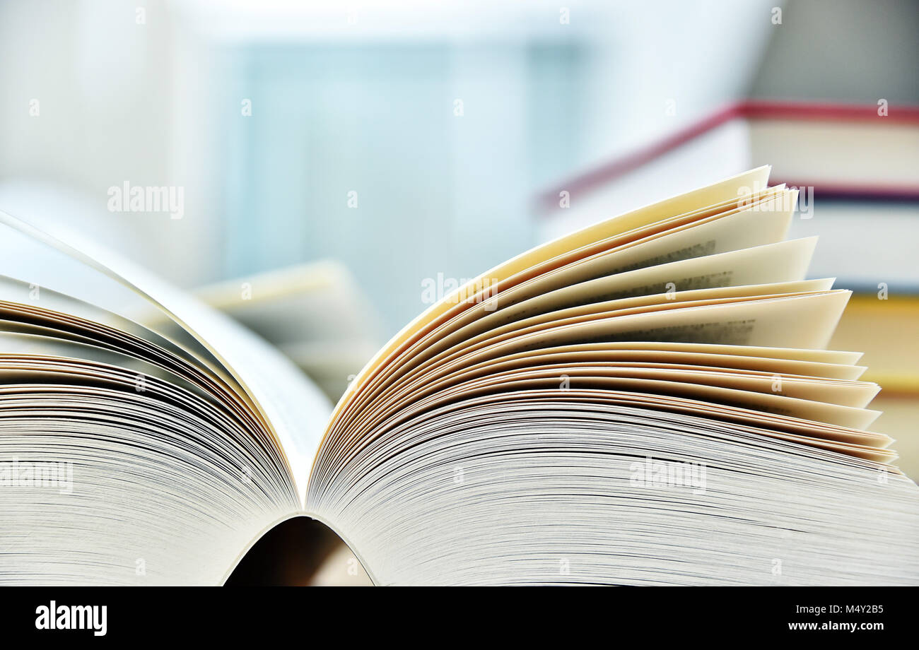 Books lying on the table in the public library Stock Photo - Alamy