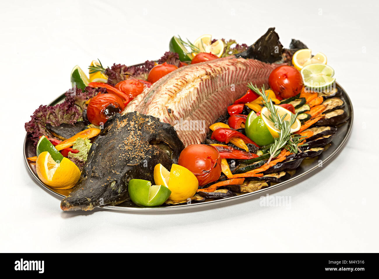 royal fish sturgeon entirely bake on the grill and served with roasted ...