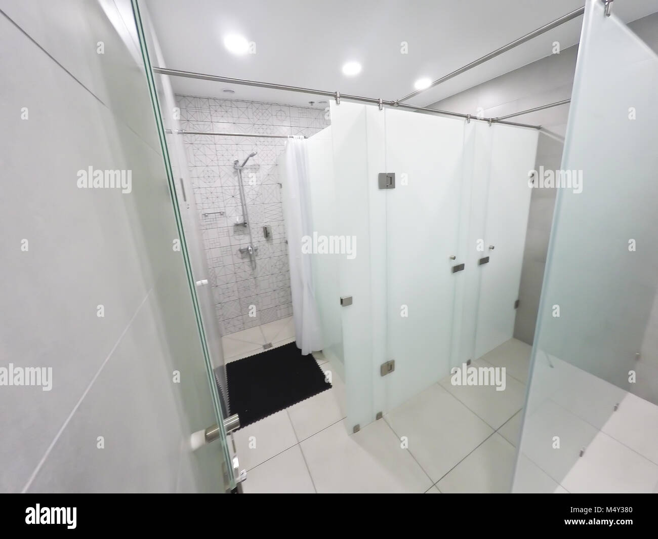 Interior of the bathroom with shower and washbasins in the modern ...