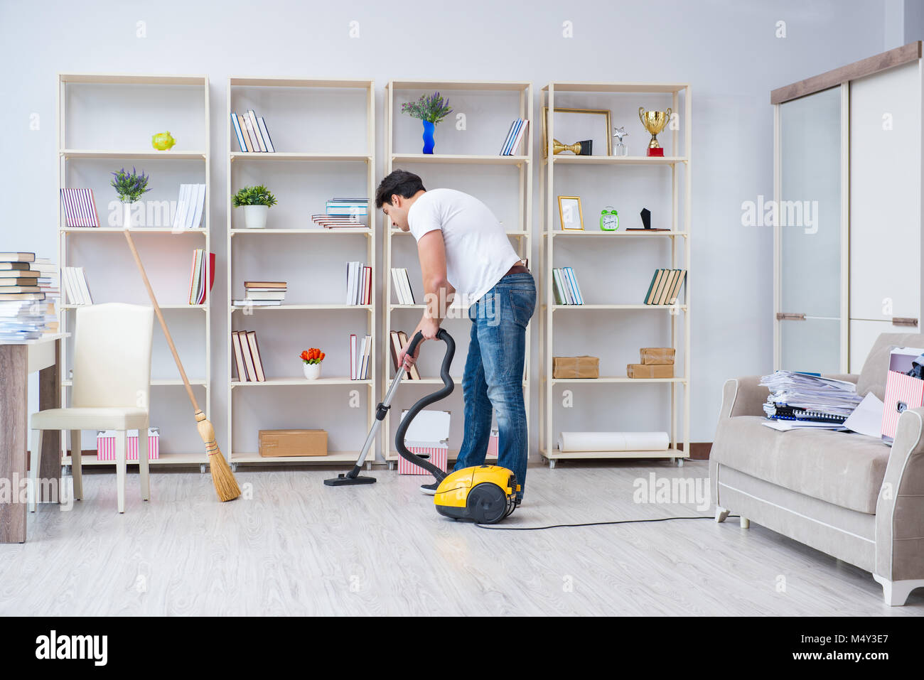 Man doing cleaning at home Stock Photo - Alamy