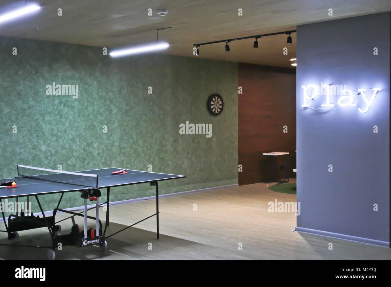 Interior of the staff rest room with a tennis table in the modern ...