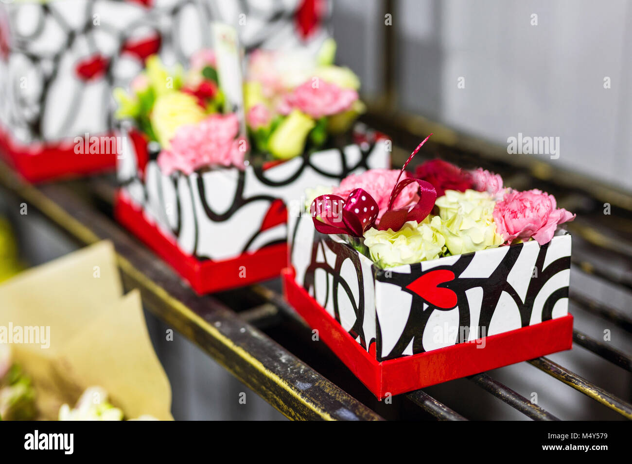 Beautiful bouquet of fresh flowers in boxes. Florist service concept ...