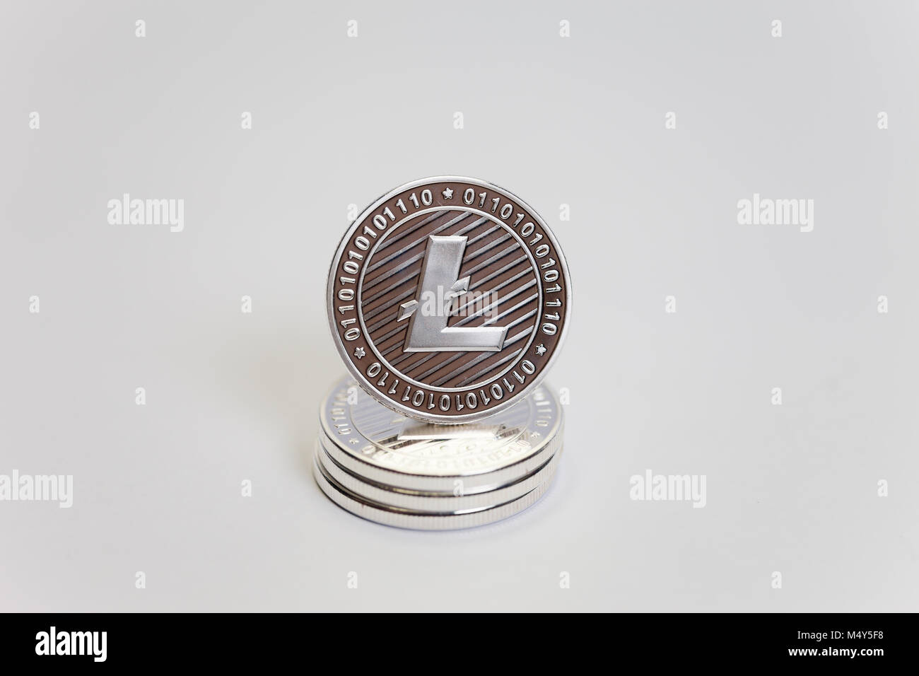 A stack of Litecoin coins on a white background Stock Photo - Alamy