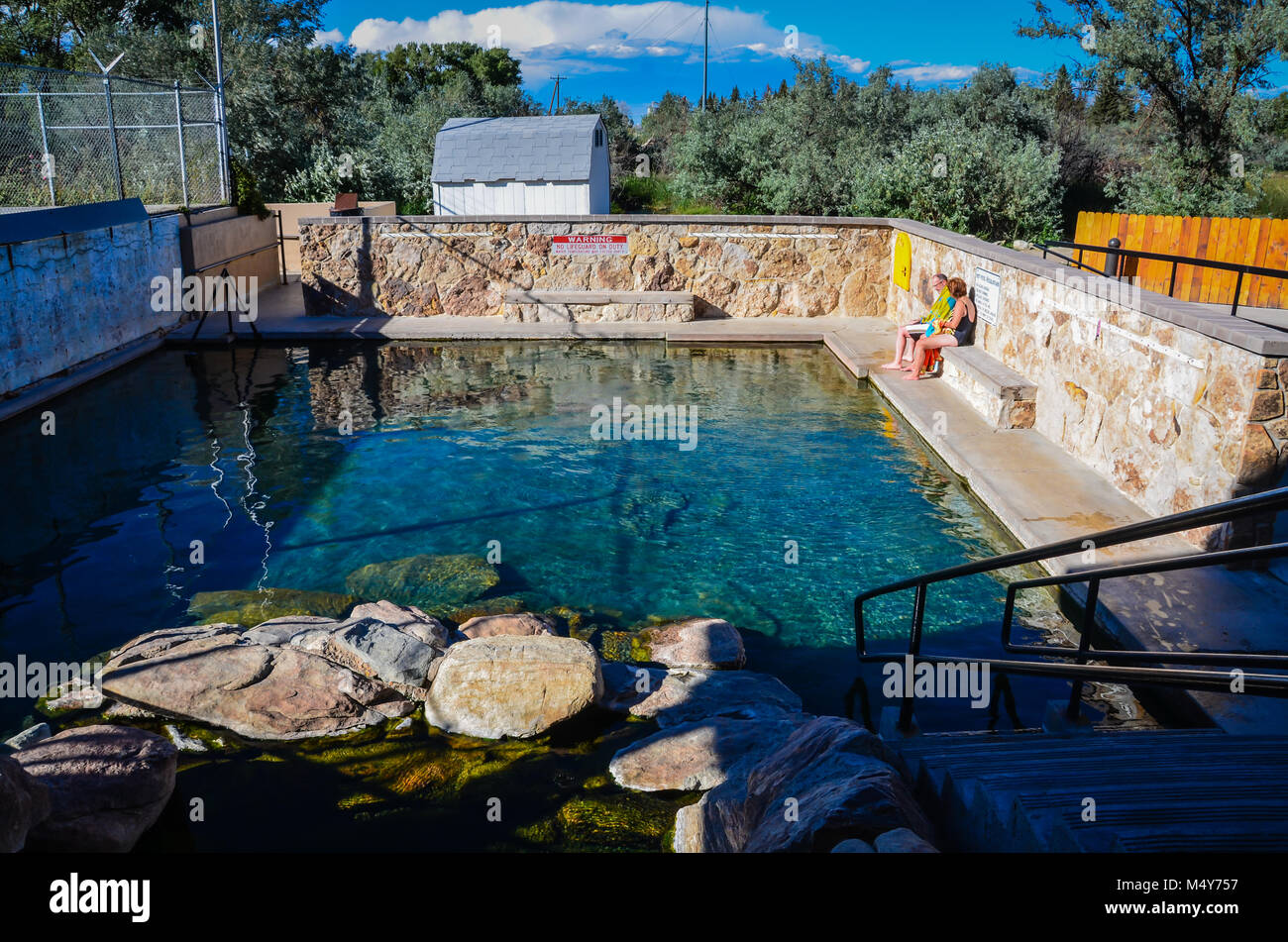 Saratoga, WY, USA. Hobo Hot Pool, a natural hot springs encased in a ...