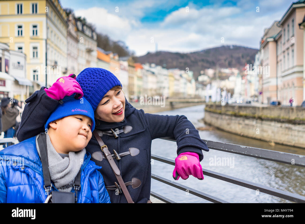 PRAGUE, CZECH REPUBLIC - MARCH 4, 2016: Asian boy and mom are travel in ...