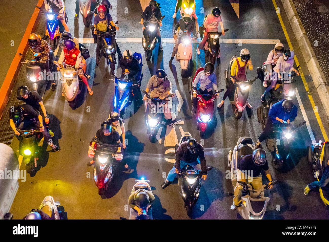 TAIPEI, TAIWAN - APRIL 19: View of motorbikes waiting at a traffic ...