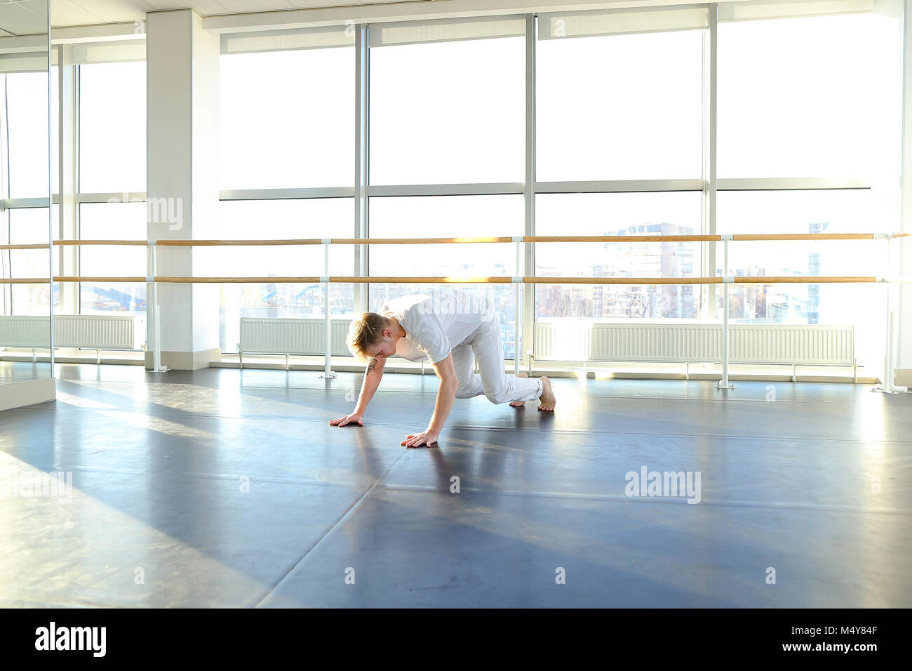 Man raising legs high at studio Stock Photo - Alamy