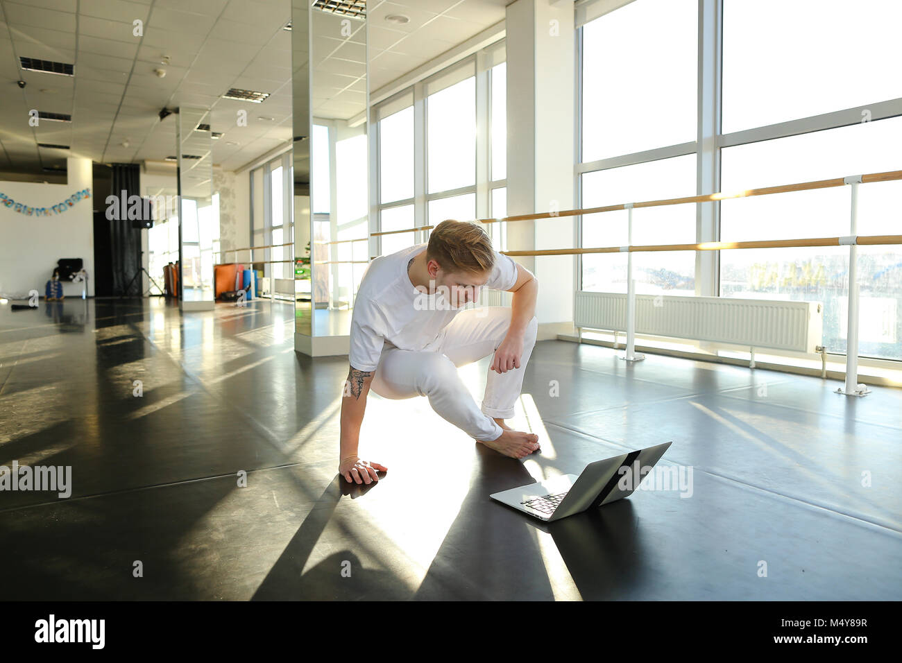 Young man learning new dancing technique with laptop tutorial Stock ...
