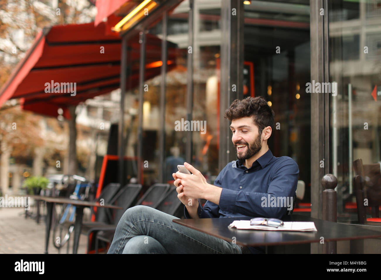 Boy talking with girlfriend by smartphone video call and earphon Stock ...