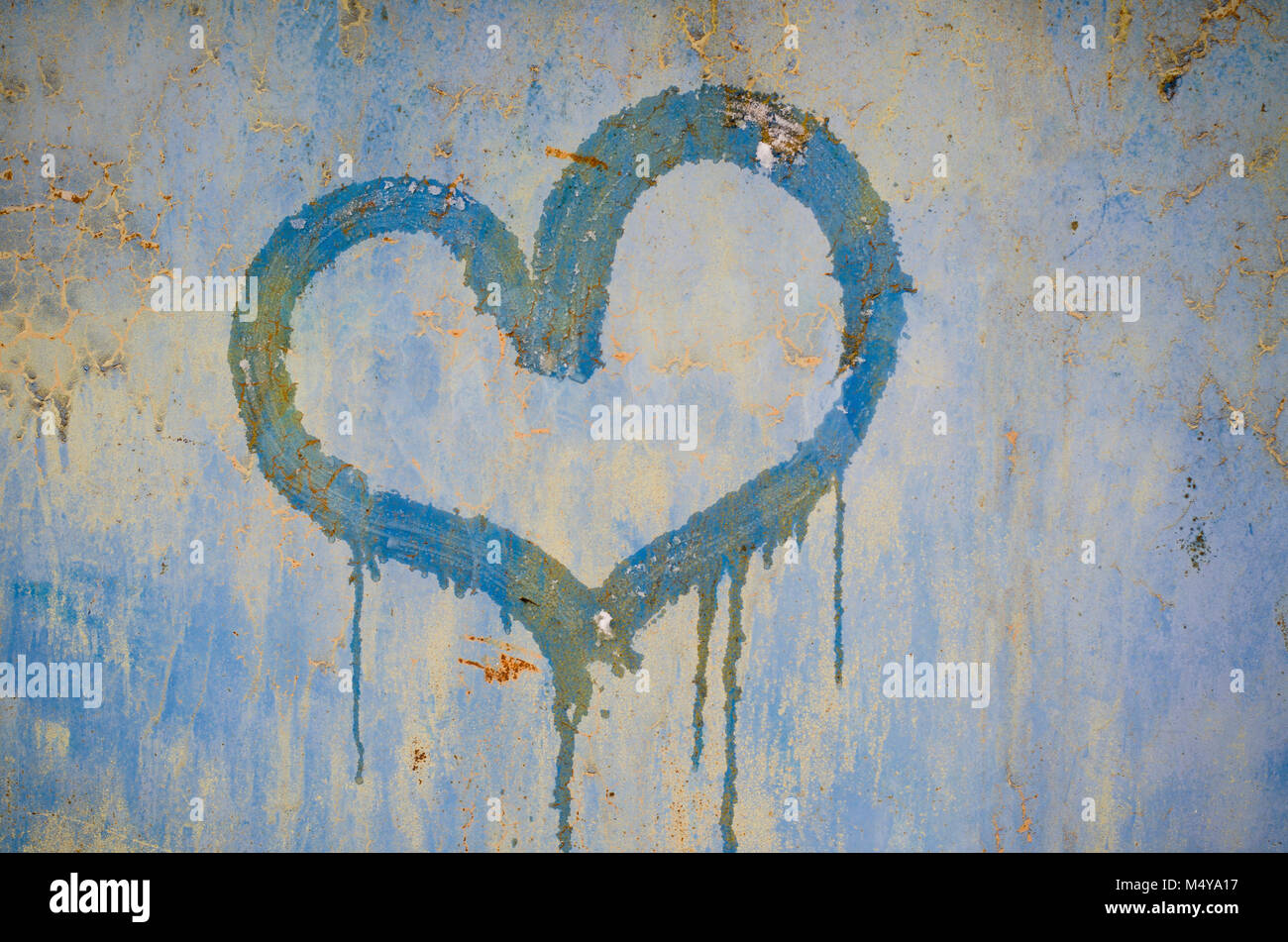 painted heart on a rusty iron background. metallic rust texture with ...