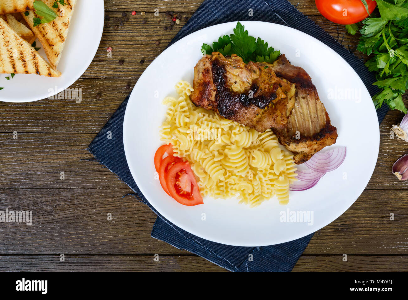 Pasta Radiatori and fried rabbit ribs Stock Photo - Alamy
