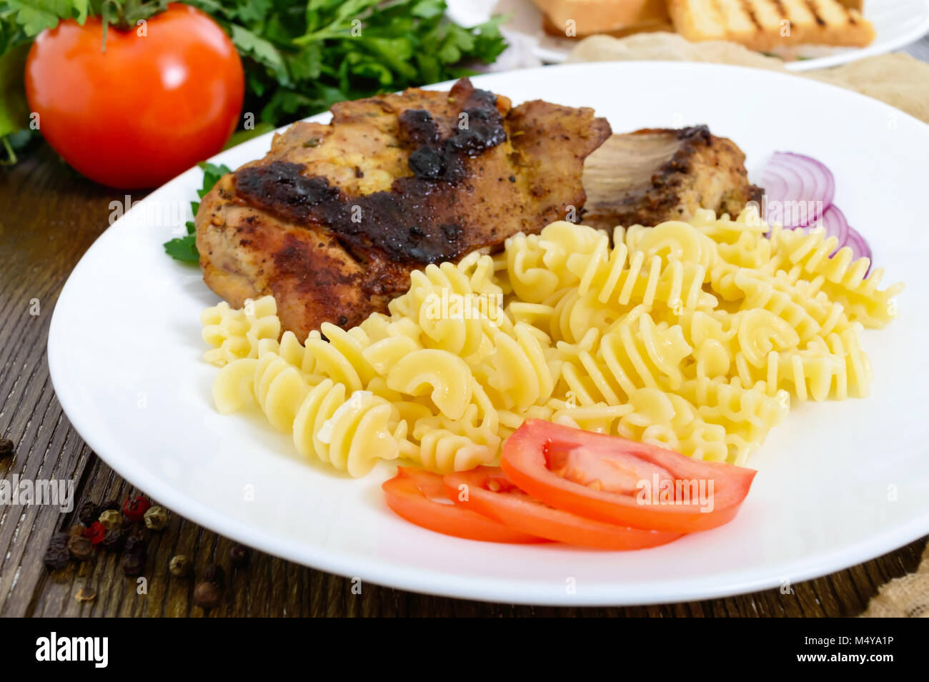 Pasta Radiatori and fried rabbit ribs Stock Photo - Alamy
