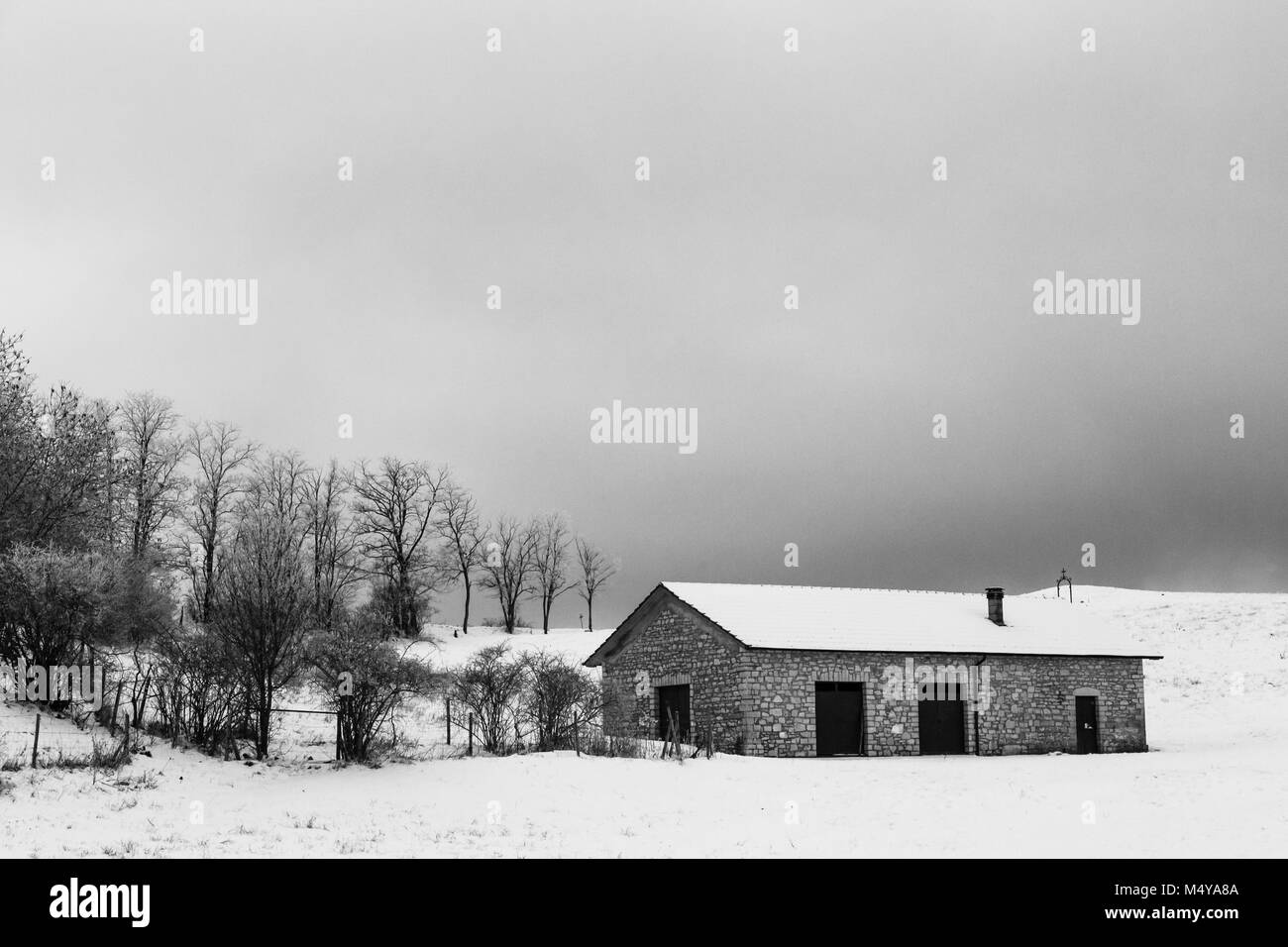 A small mountain retreat covered by snow on Mt. Subasio (Umbria, Italy ...