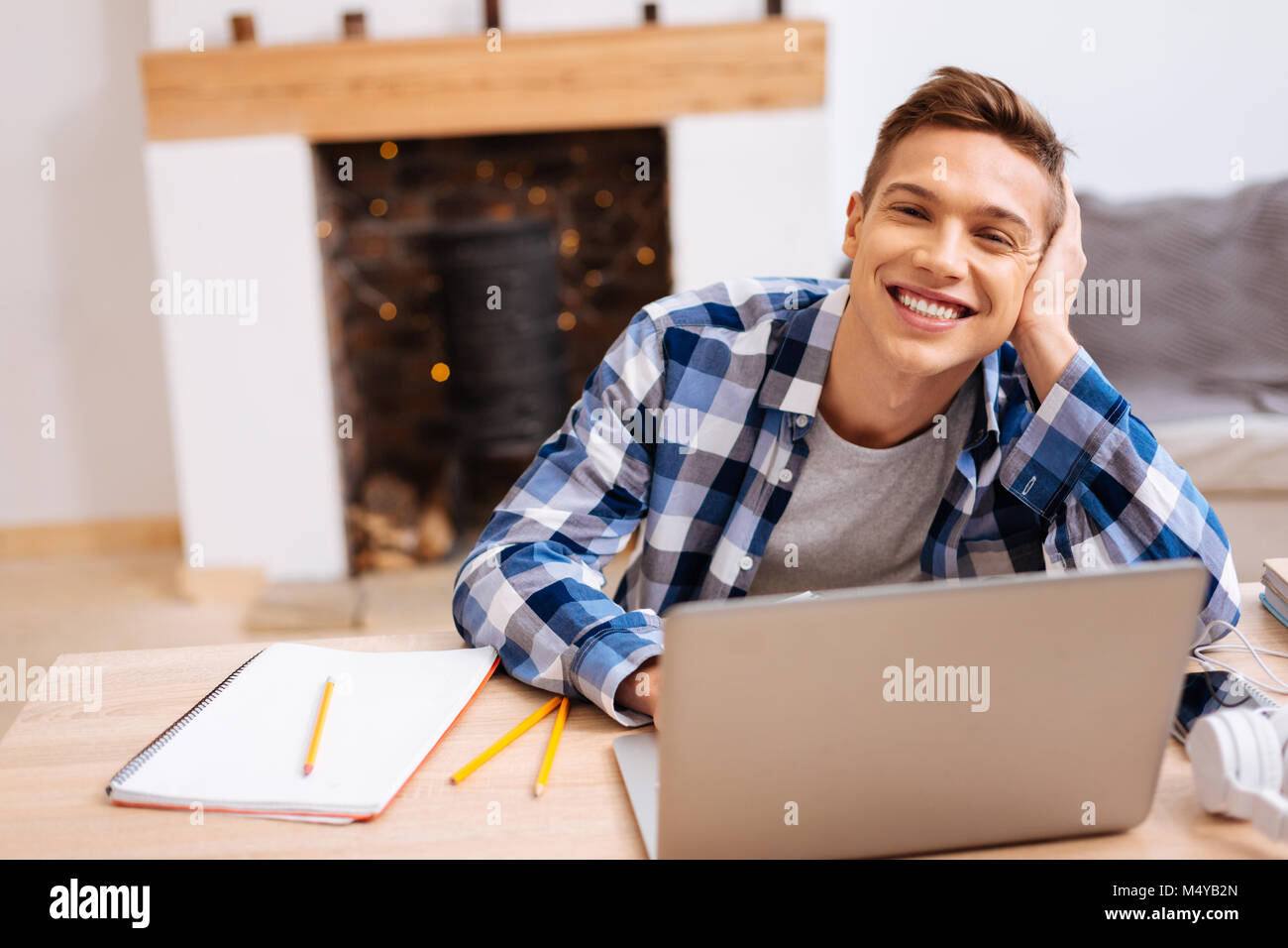Happy teenager learning his lessons at home Stock Photo - Alamy