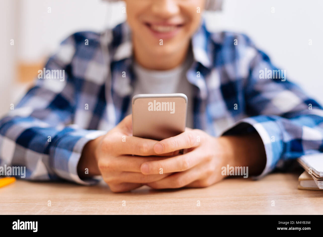 Happy boy typing on his modern digital device Stock Photo - Alamy