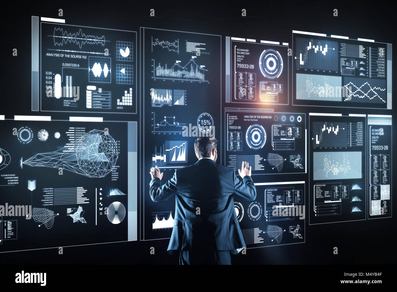 Experienced administrator standing alone and analyzing the information ...