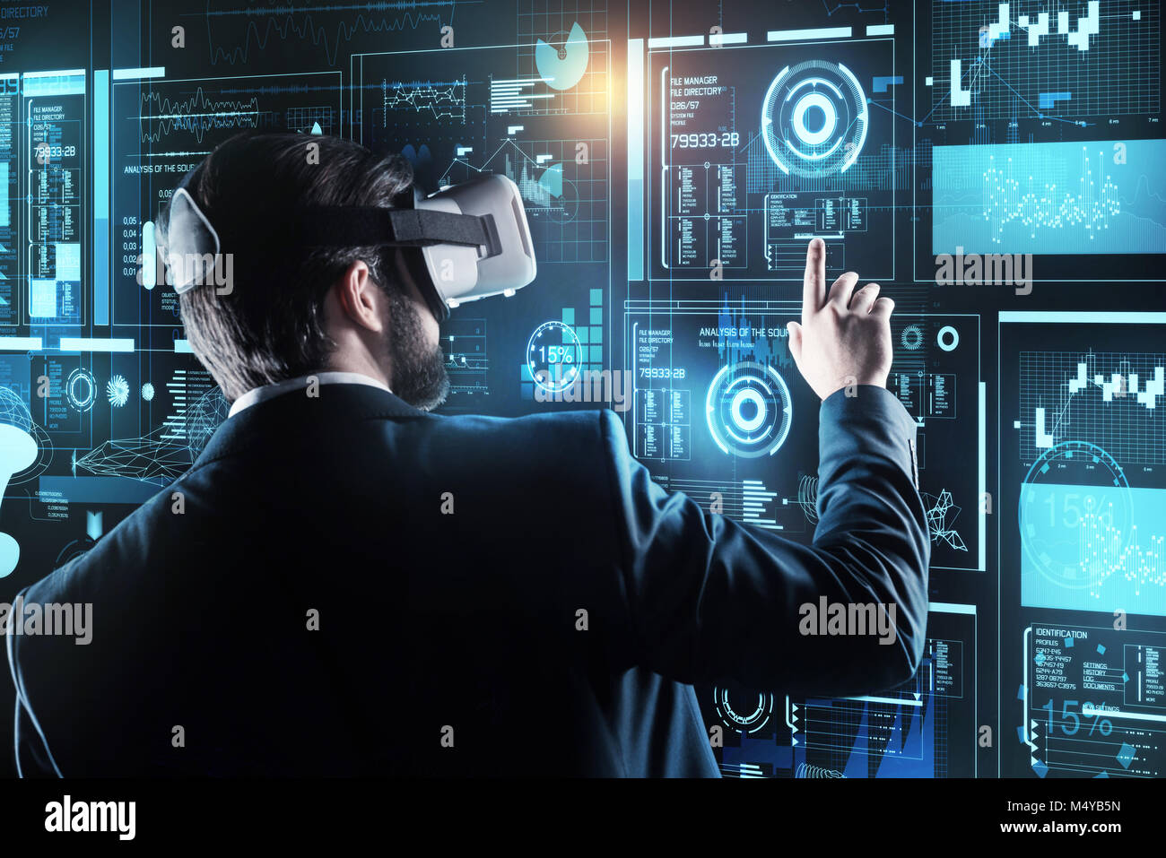 Bearded programmer wearing special glasses while working Stock Photo ...