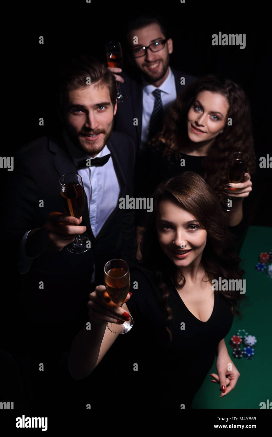 group of friends celebrating win at the casino Stock Photo - Alamy