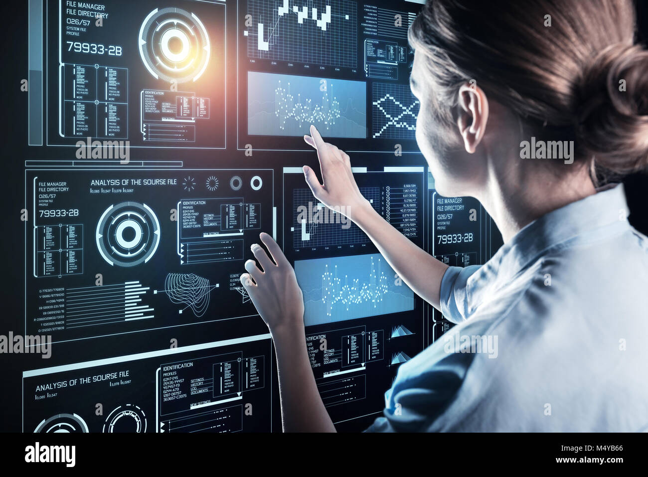 Smart woman touching the screen while working on her computer Stock ...